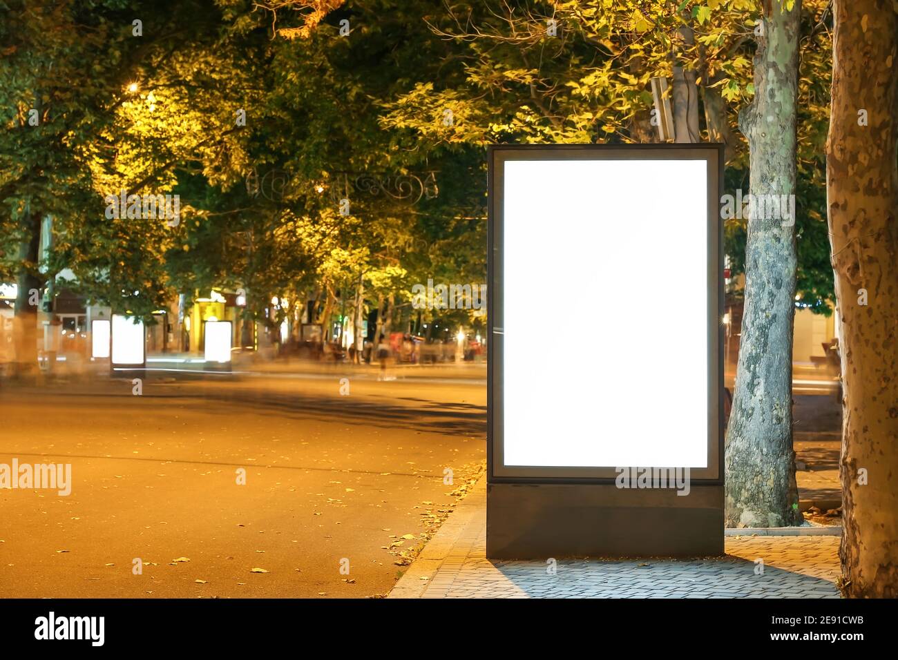 Blank advertising billboard on city street at night Stock Photo - Alamy
