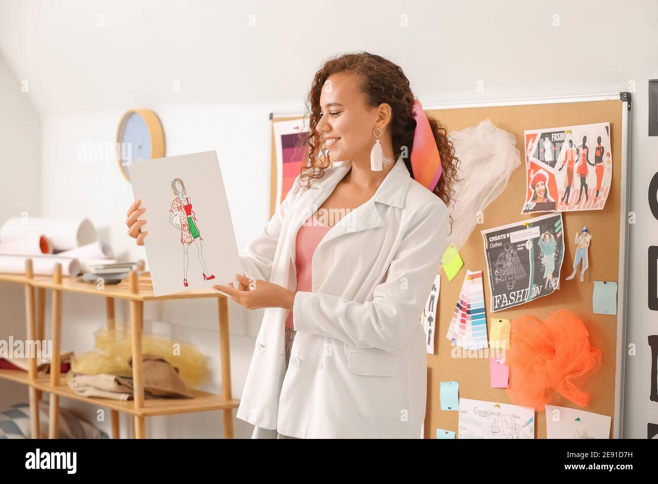 Female fashion designer working in studio Stock Photo - Alamy