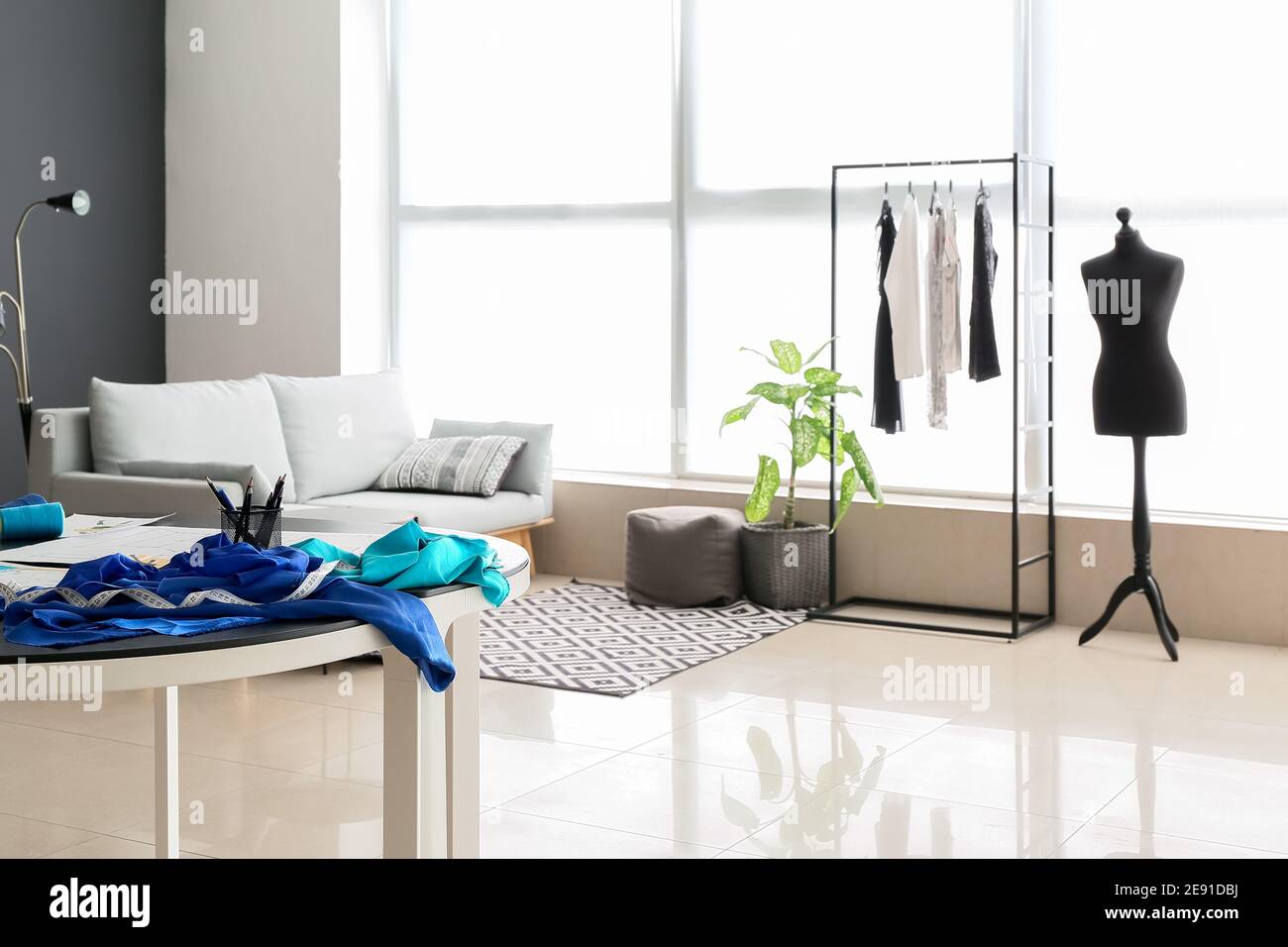 Stylish interior of fashion designer workplace Stock Photo - Alamy