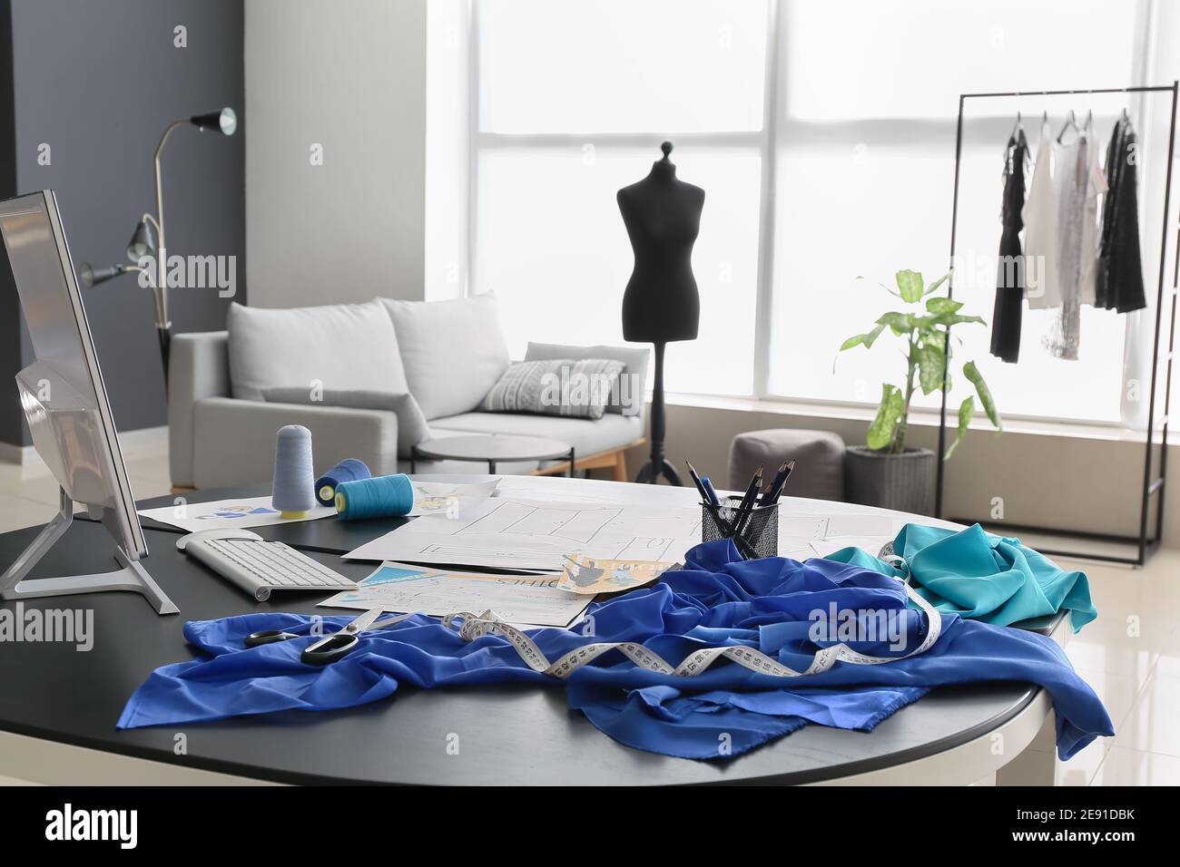 Stylish interior of fashion designer workplace Stock Photo - Alamy