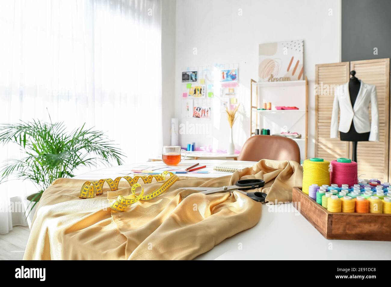 Stylish interior of fashion designer workplace Stock Photo - Alamy