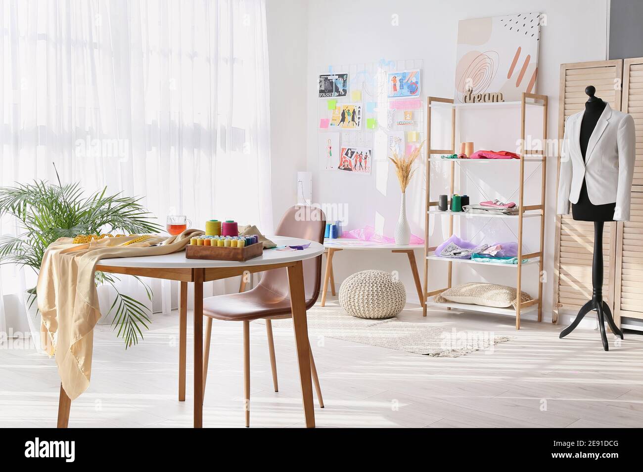 Stylish interior of fashion designer workplace Stock Photo - Alamy