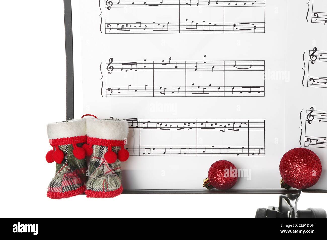 Music sheets with notes and Christmas decor on white background Stock ...