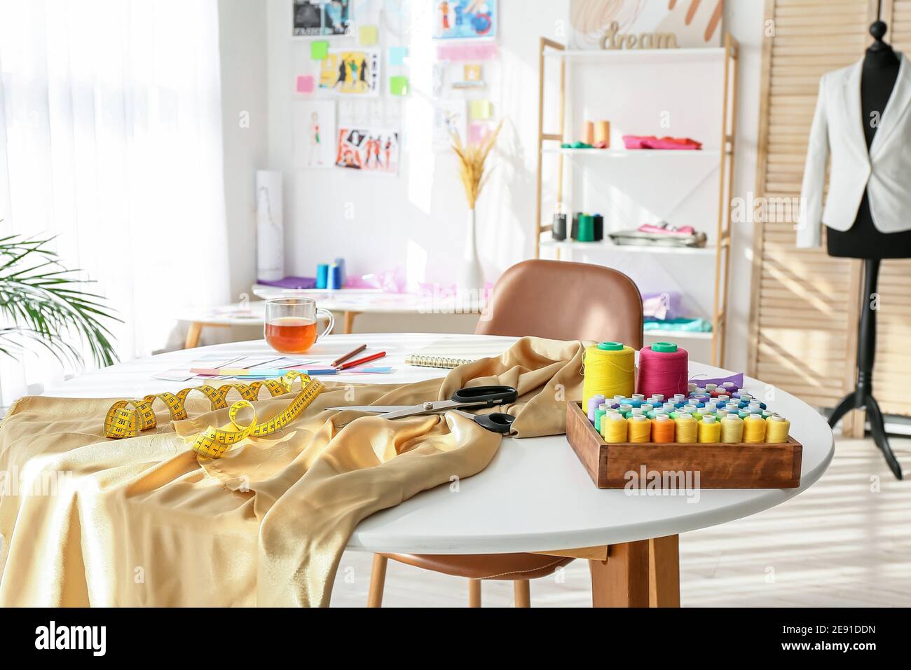 Stylish interior of fashion designer workplace Stock Photo - Alamy