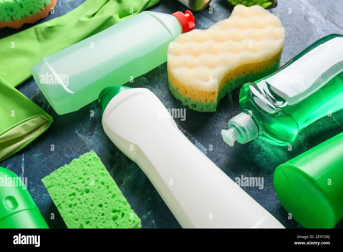 Set of cleaning supplies on dark background Stock Photo - Alamy