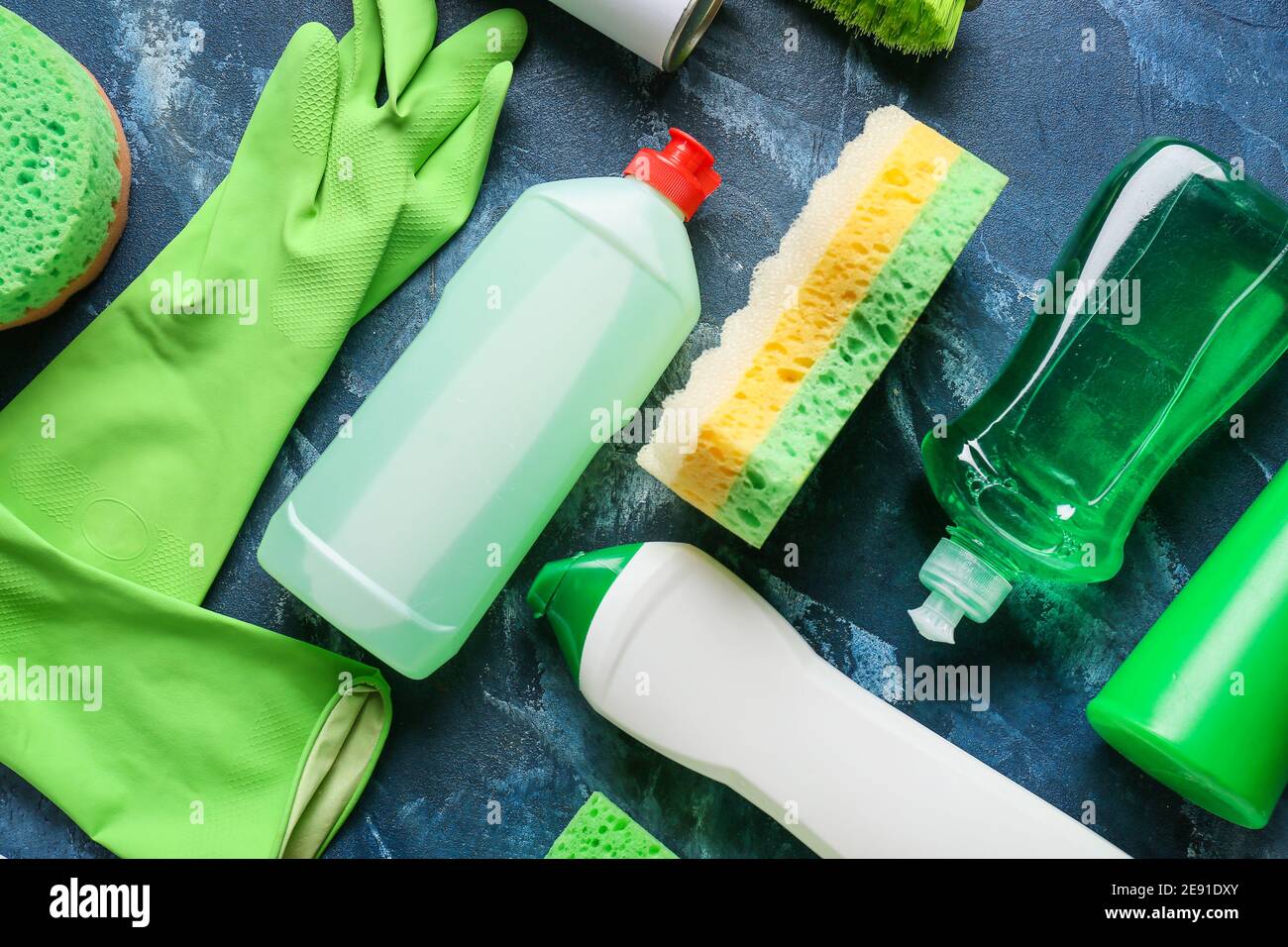 Set of cleaning supplies on dark background Stock Photo - Alamy