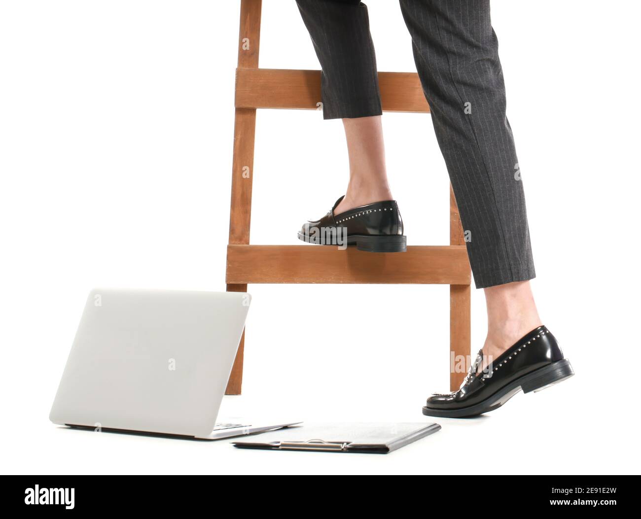 Businesswoman climbing up ladder isolated on white background Stock ...