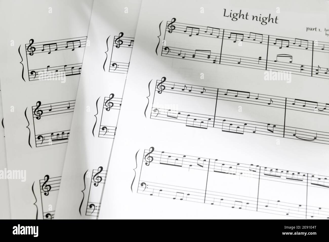 Paper sheets with music notes, closeup Stock Photo - Alamy