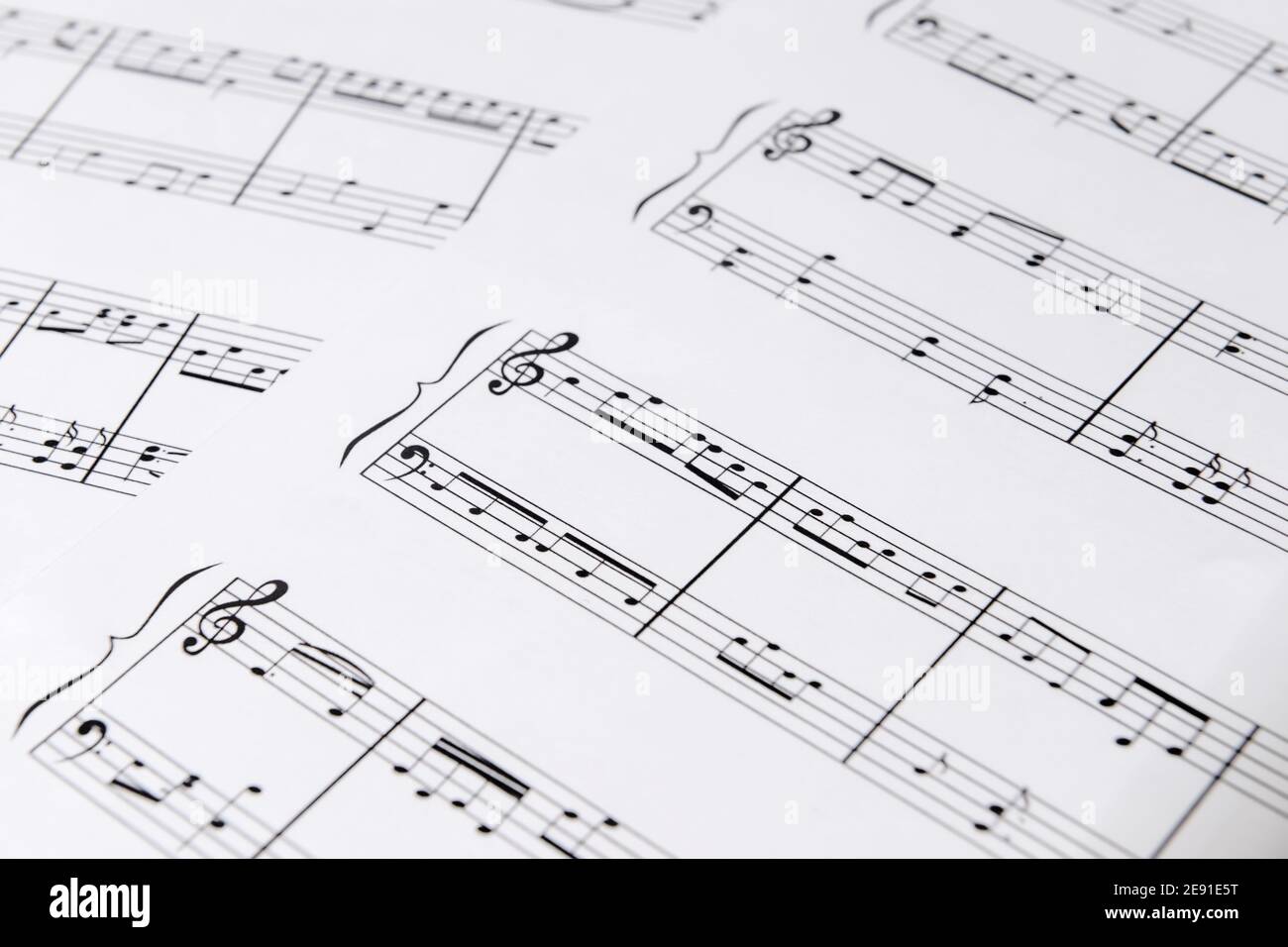Paper sheets with music notes, closeup Stock Photo - Alamy