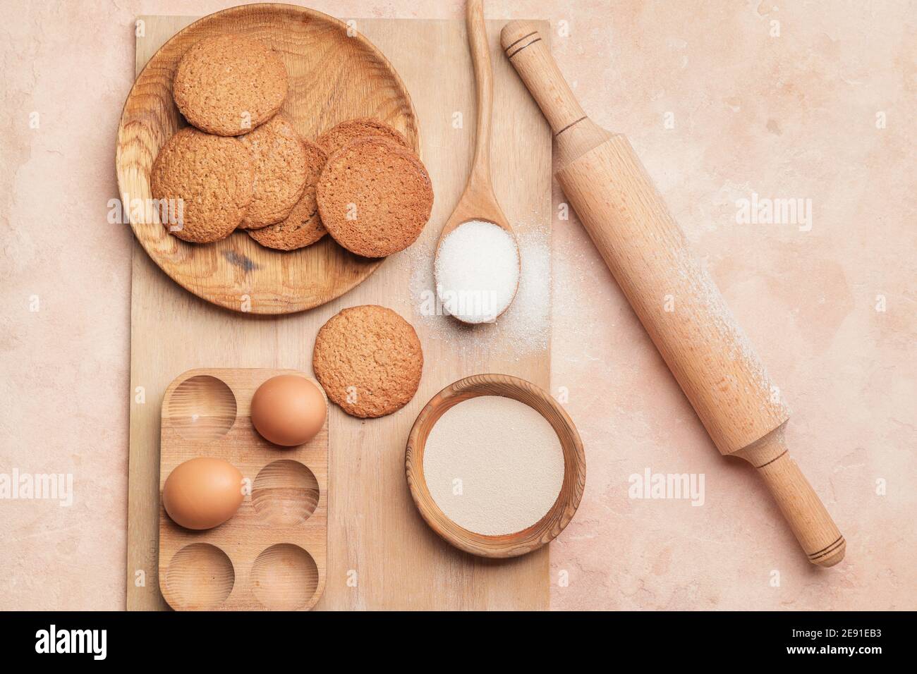 Ingredients for cookies and rolling pin on color background Stock Photo ...