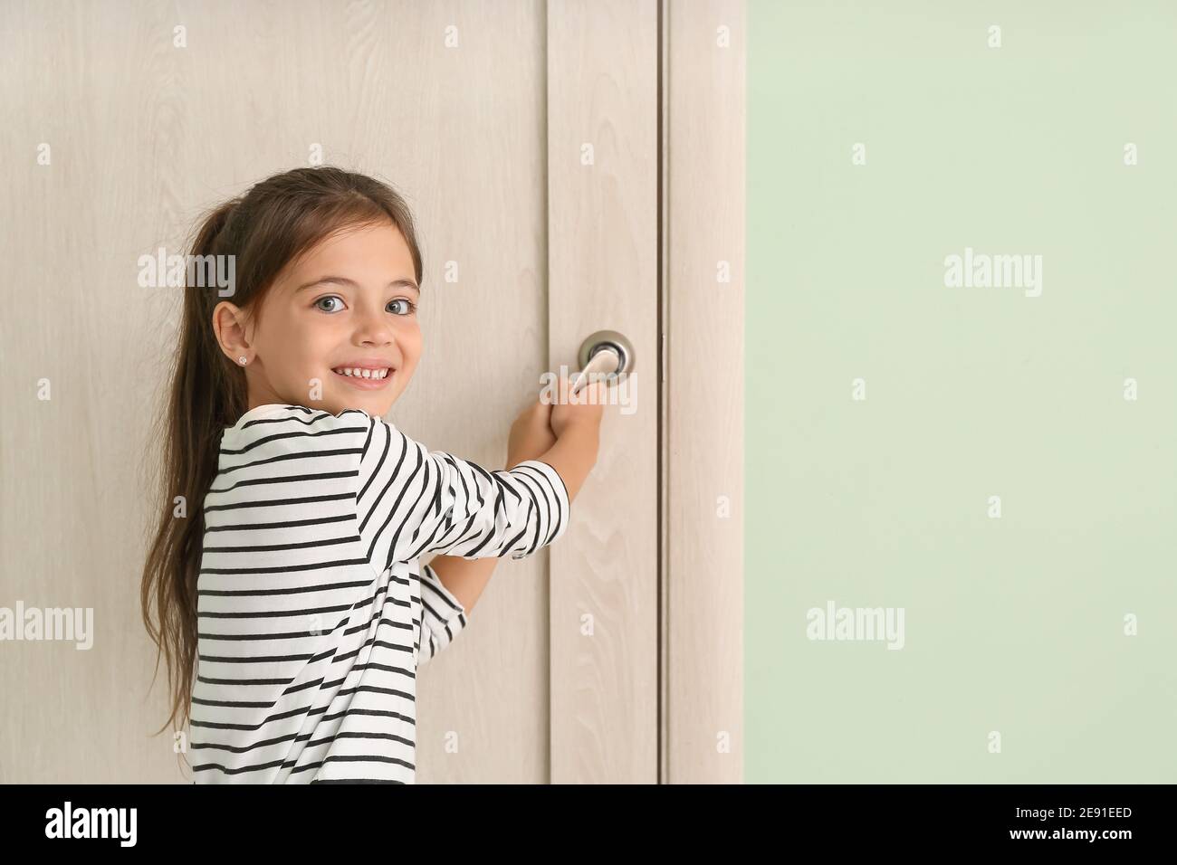 Child Holding Door Open