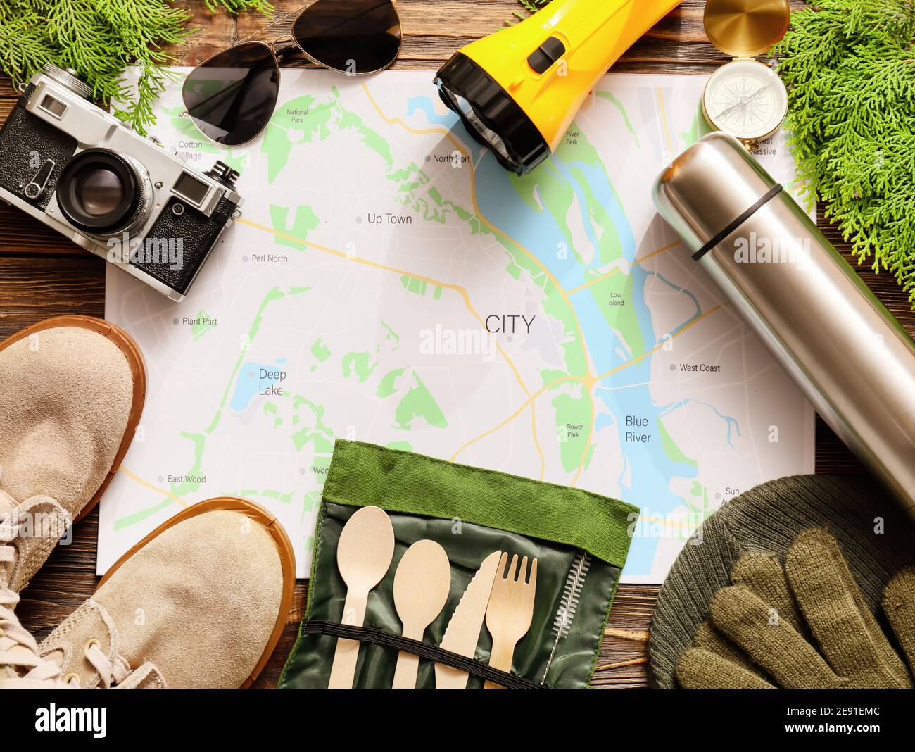 Equipment for hiking on wooden table Stock Photo - Alamy
