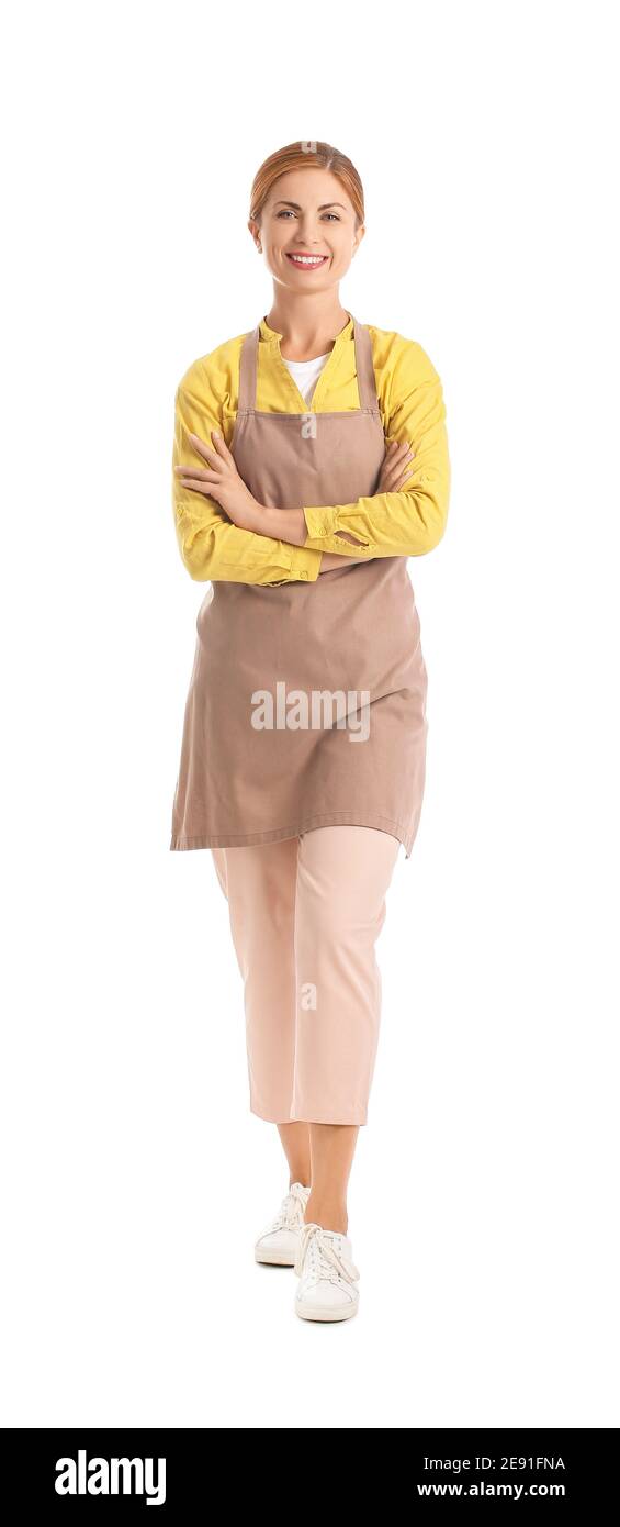 Beautiful young woman wearing apron on white background Stock Photo - Alamy