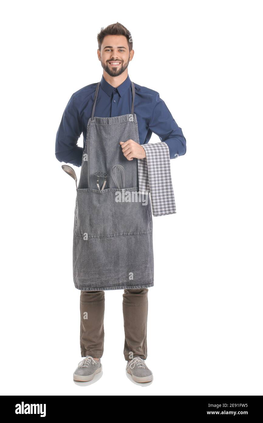 Young man wearing apron on white background Stock Photo - Alamy
