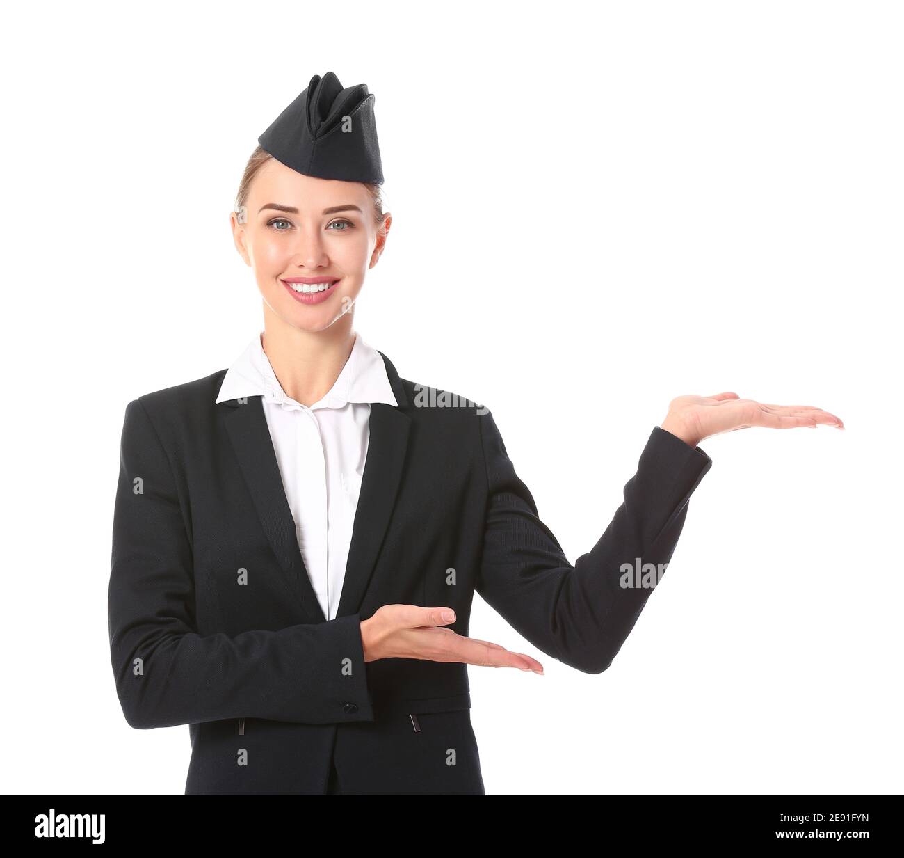 Beautiful stewardess showing something on white background Stock Photo ...