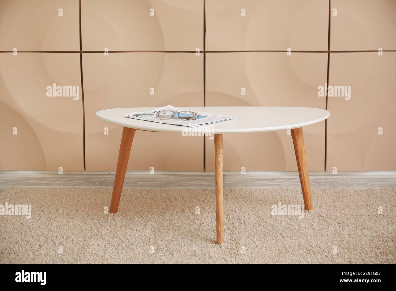 Stylish table near wall hi-res stock photography and images - Alamy