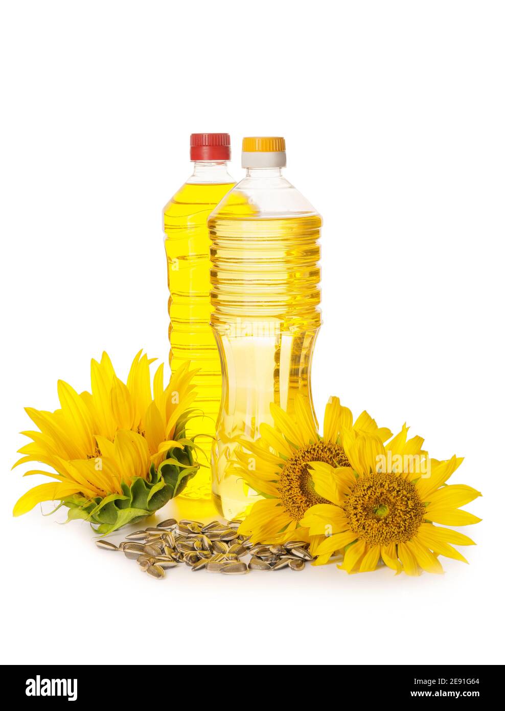 Bottles of oil, seeds and sunflowers on white background Stock Photo ...