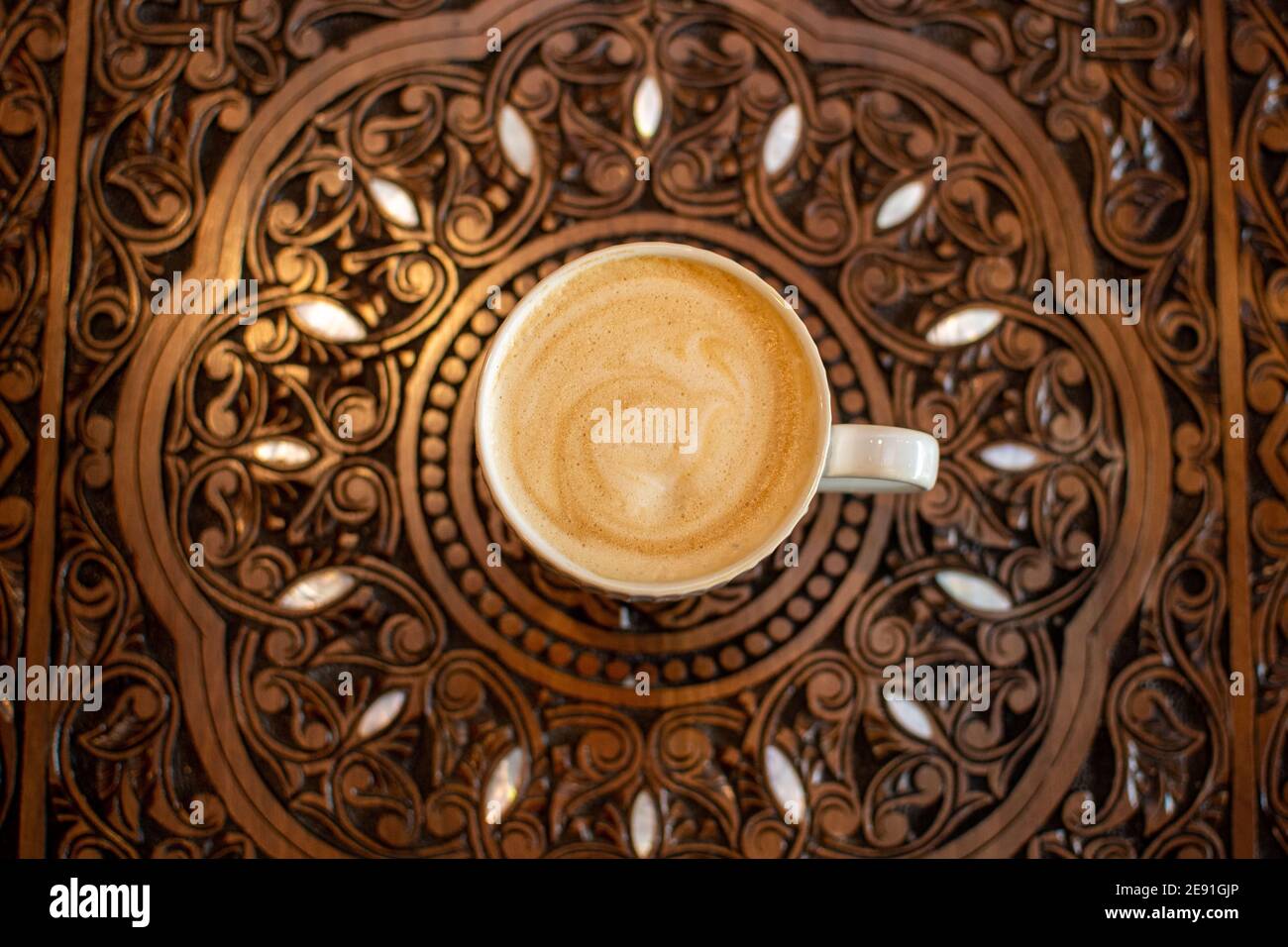 Hot coffee with an Arabic coffee shop background Stock Photo - Alamy