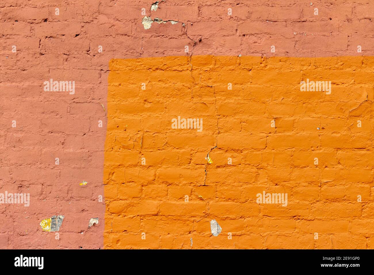 Old deteriorating rusty red color painted brick wall texture background ...