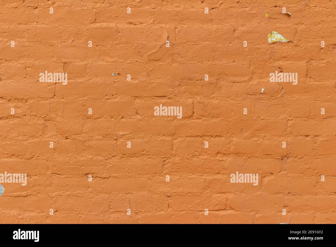 Old deteriorating rusty red color painted brick wall texture background ...