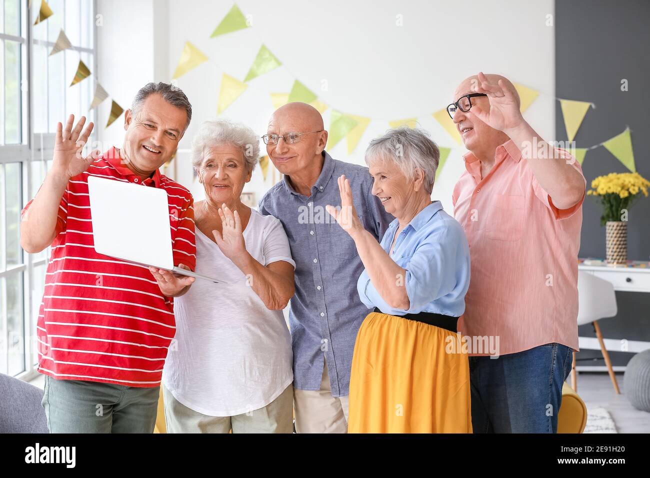 Group of senior people video chatting at home Stock Photo - Alamy