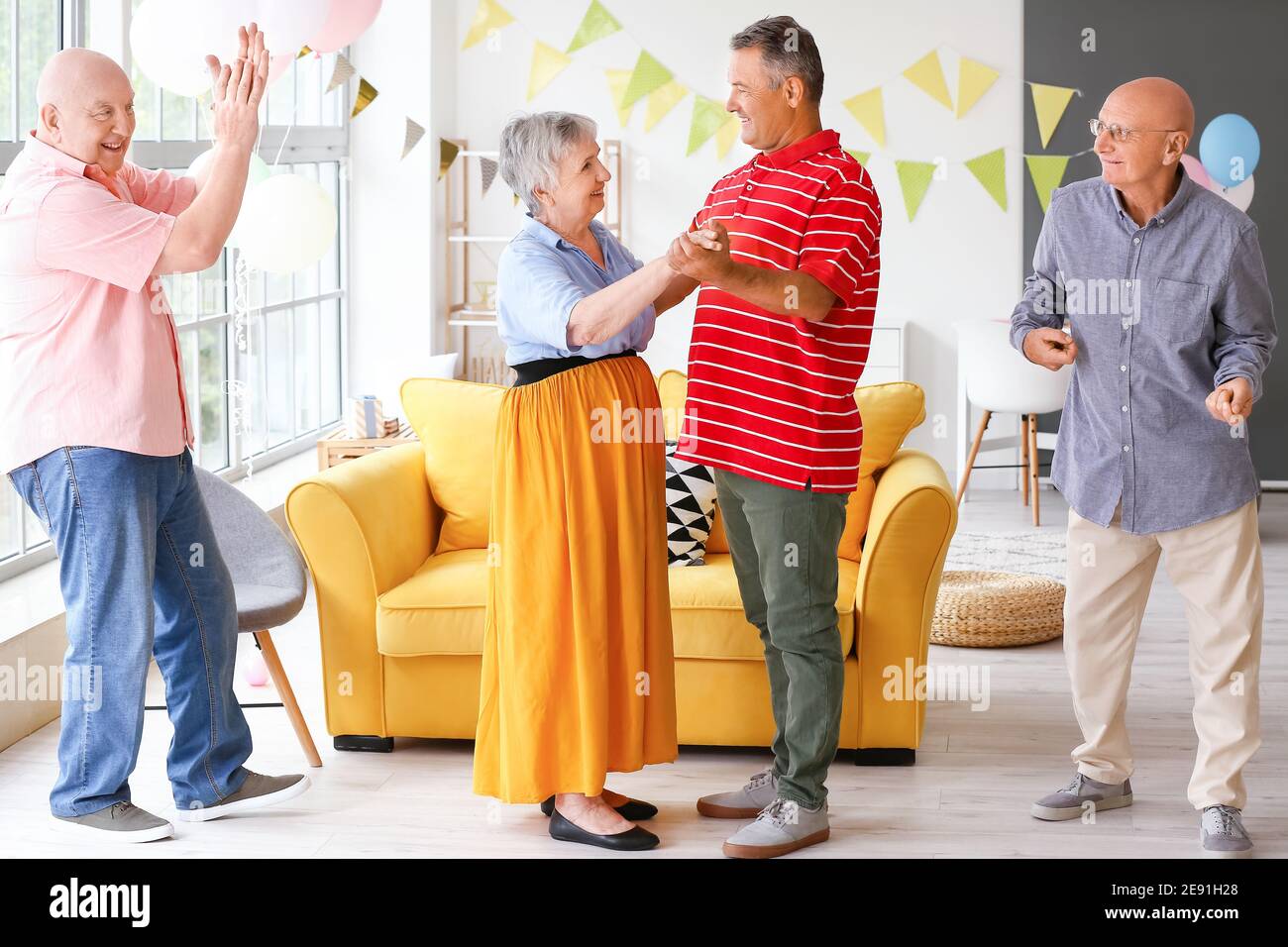 Senior people celebrating Birthday at home Stock Photo - Alamy