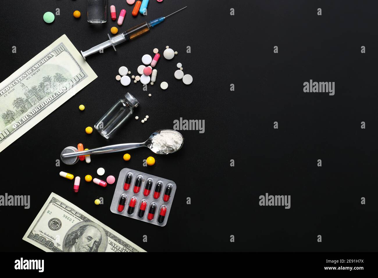 Syringe, drugs and money on dark background Stock Photo - Alamy