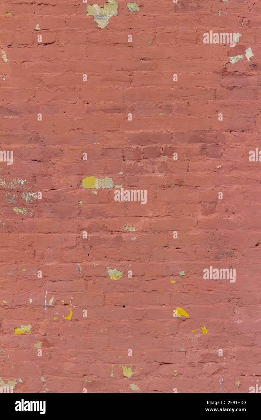 Old deteriorating rusty red color painted brick wall texture background ...