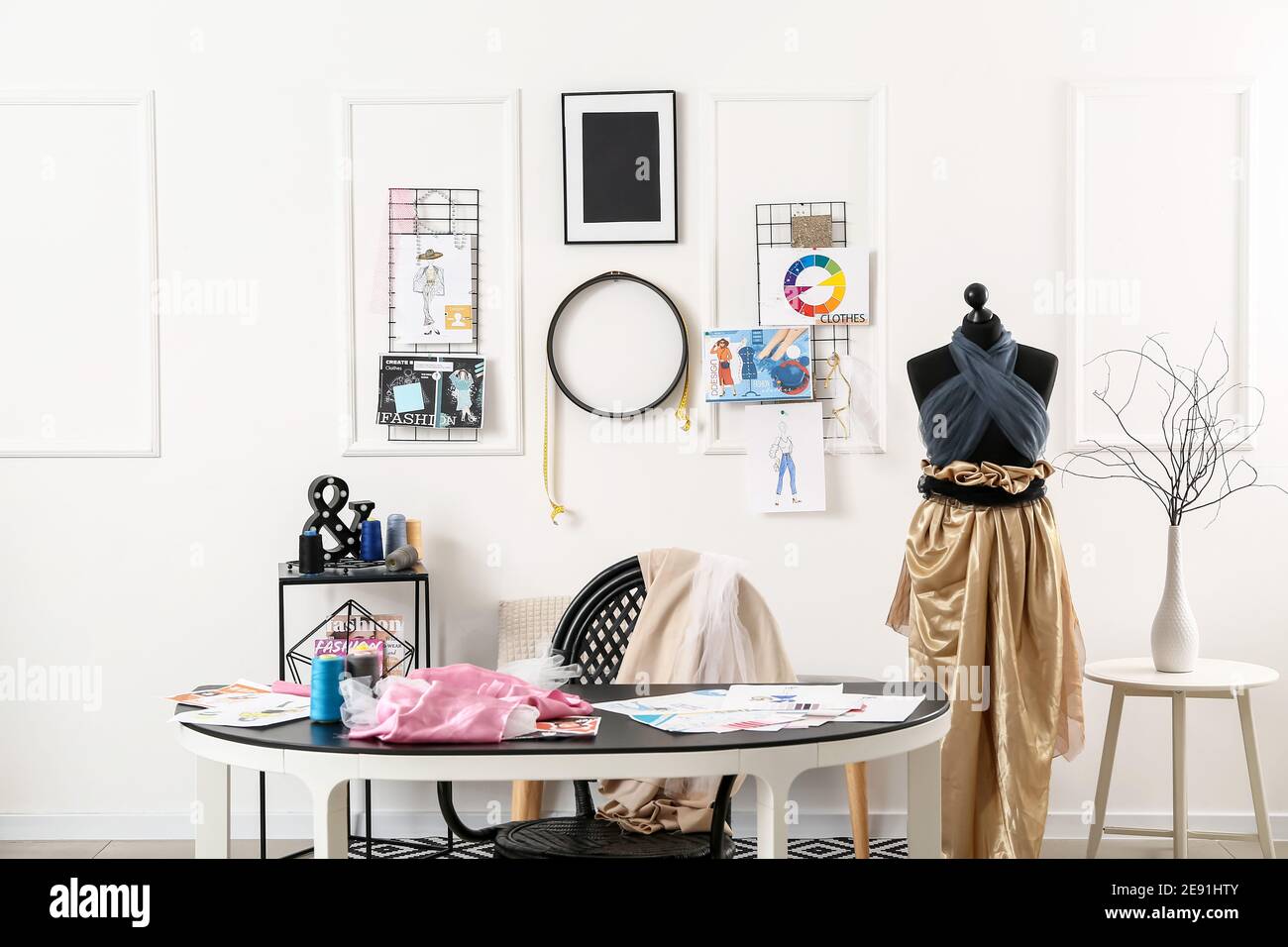 Stylish interior of fashion designer workplace Stock Photo - Alamy