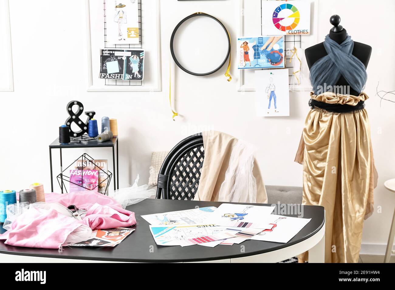 Stylish interior of fashion designer workplace Stock Photo - Alamy