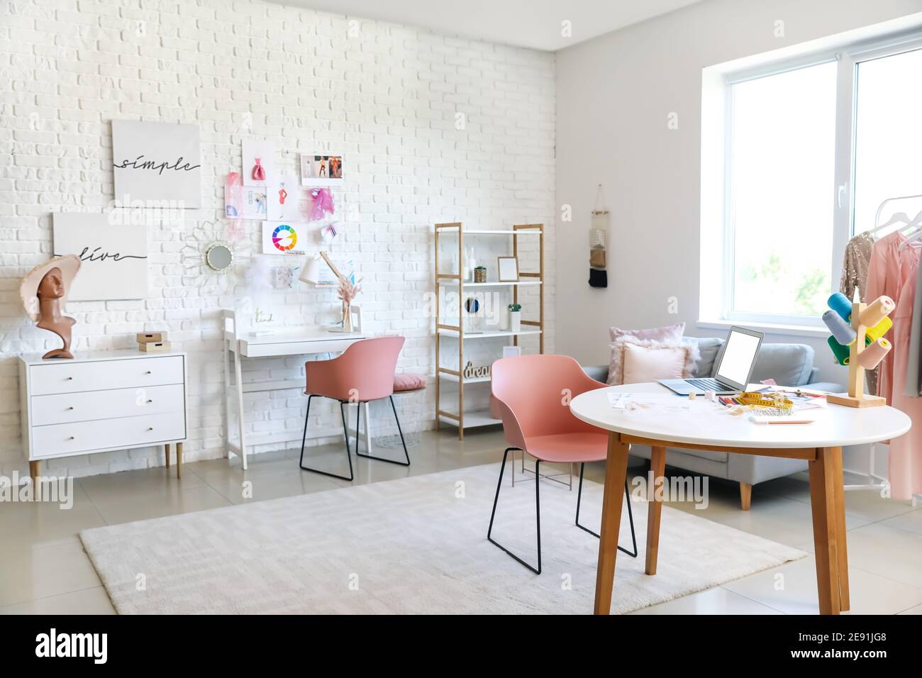 Stylish interior of fashion designer workplace Stock Photo - Alamy