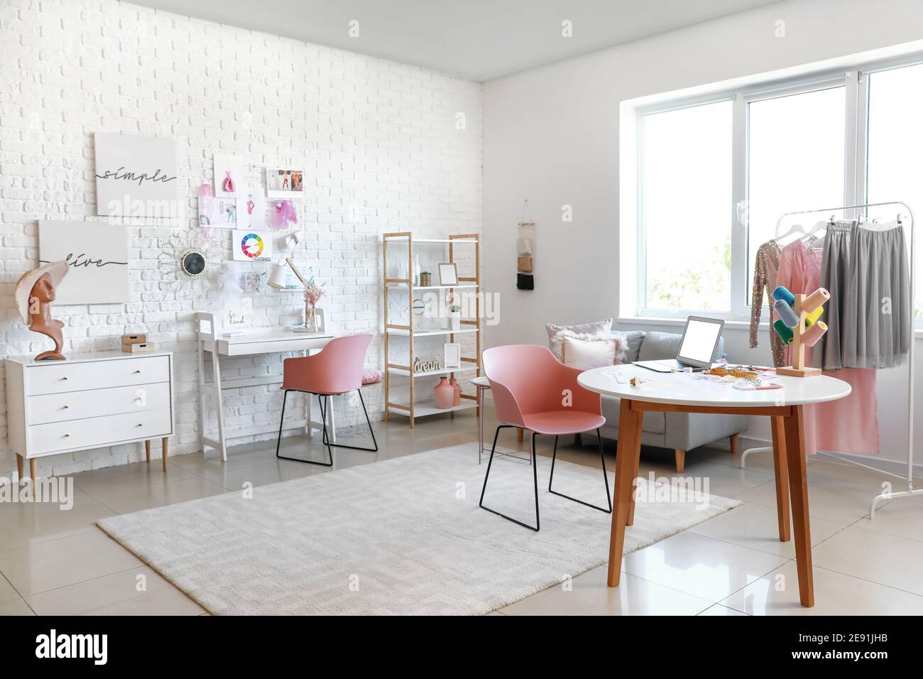 Stylish interior of fashion designer workplace Stock Photo - Alamy