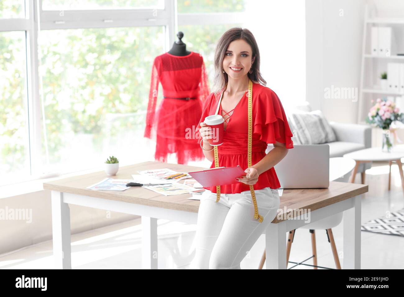 Female fashion designer working in studio Stock Photo - Alamy