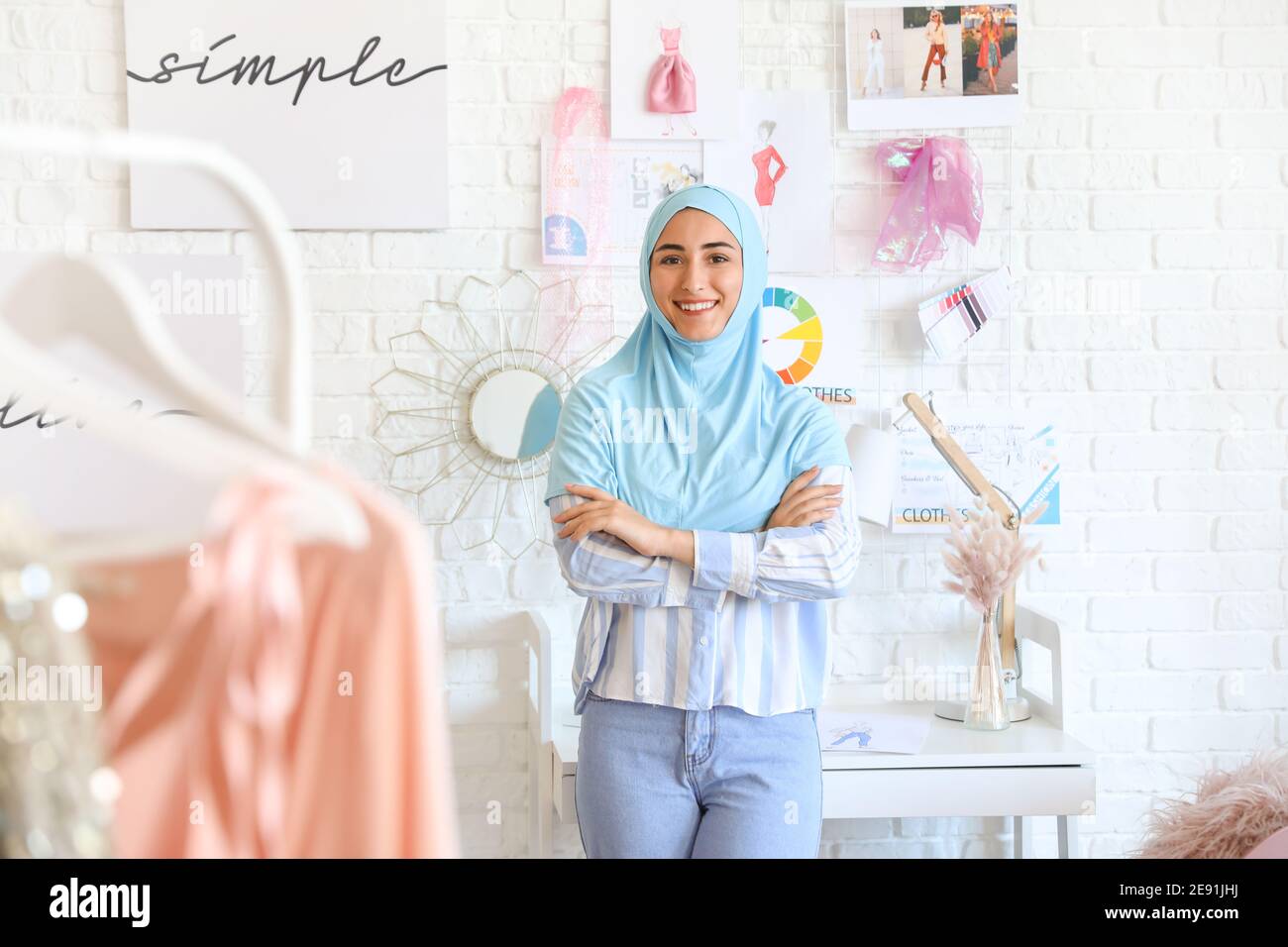Female Muslim fashion designer in modern studio Stock Photo - Alamy