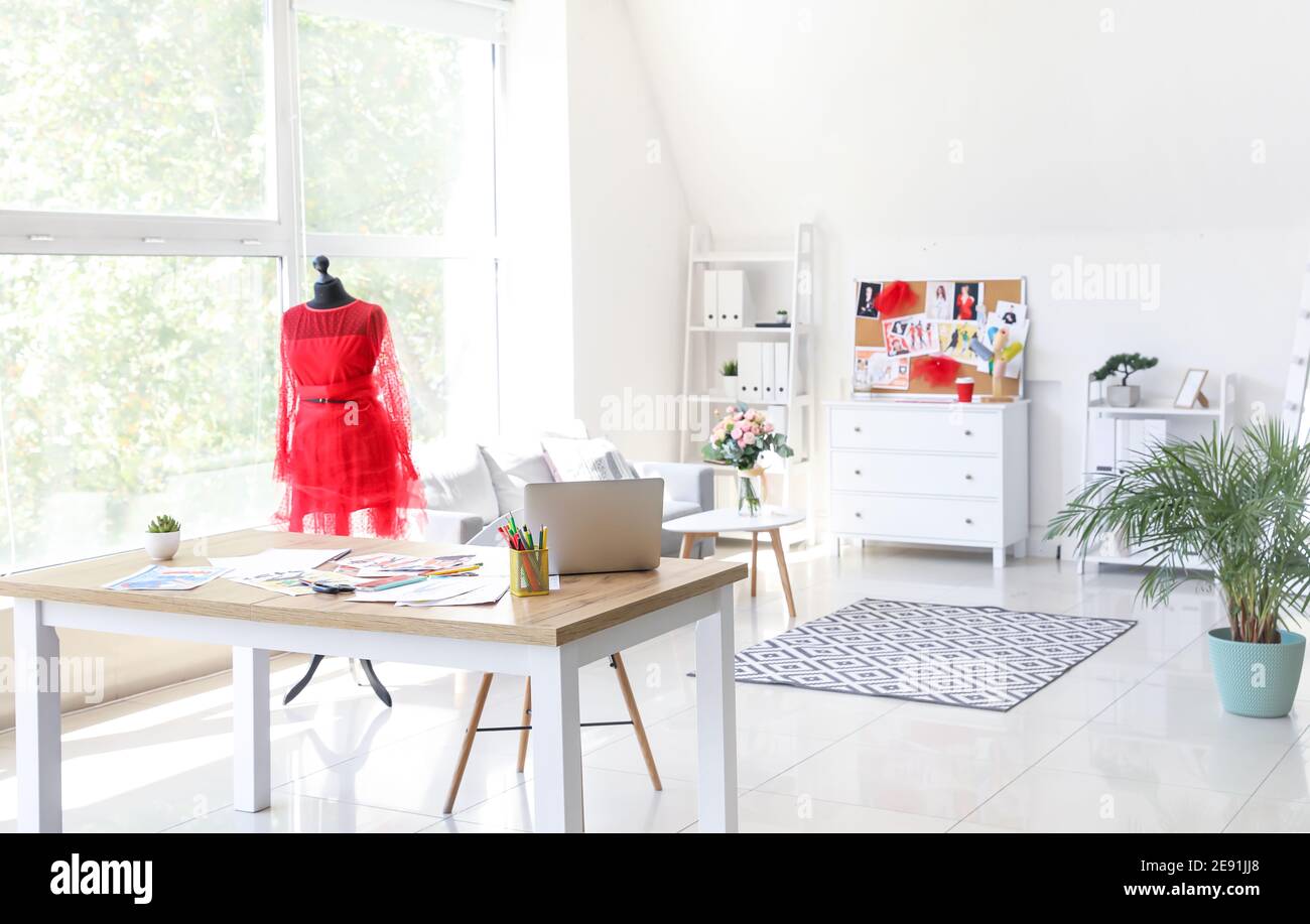 Stylish interior of fashion designer workplace Stock Photo - Alamy