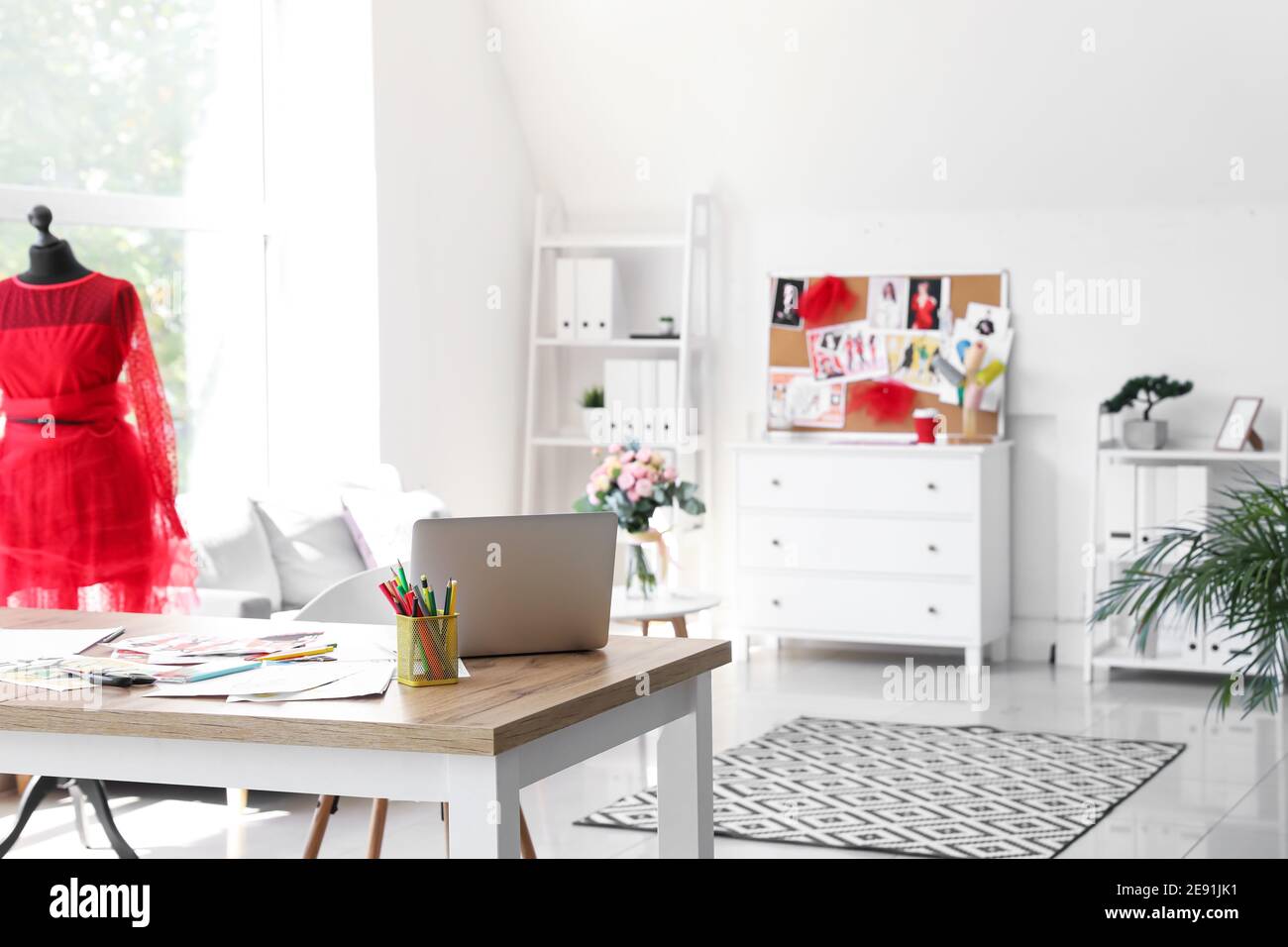 Stylish interior of fashion designer workplace Stock Photo - Alamy