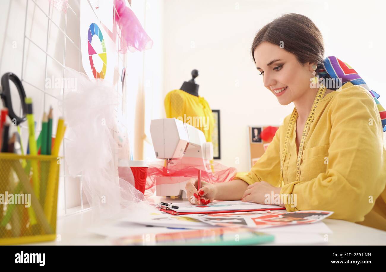 Female fashion designer working in studio Stock Photo - Alamy