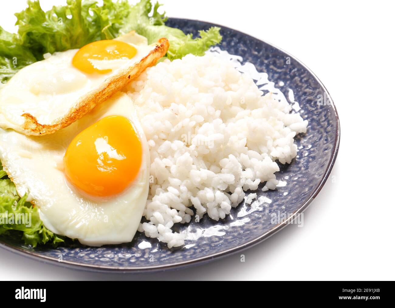 Plate with tasty eggs and rice on white background Stock Photo - Alamy