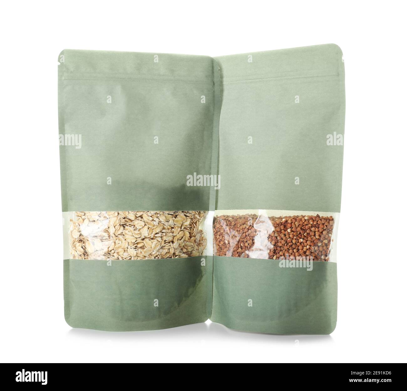 Paper bags with buckwheat and oatmeal on white background Stock Photo ...
