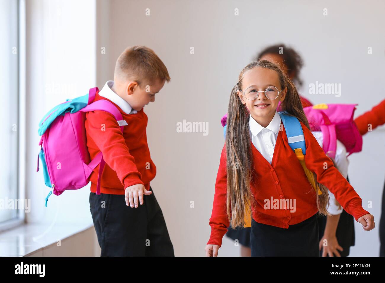 Little pupils playing in school hall Stock Photo - Alamy