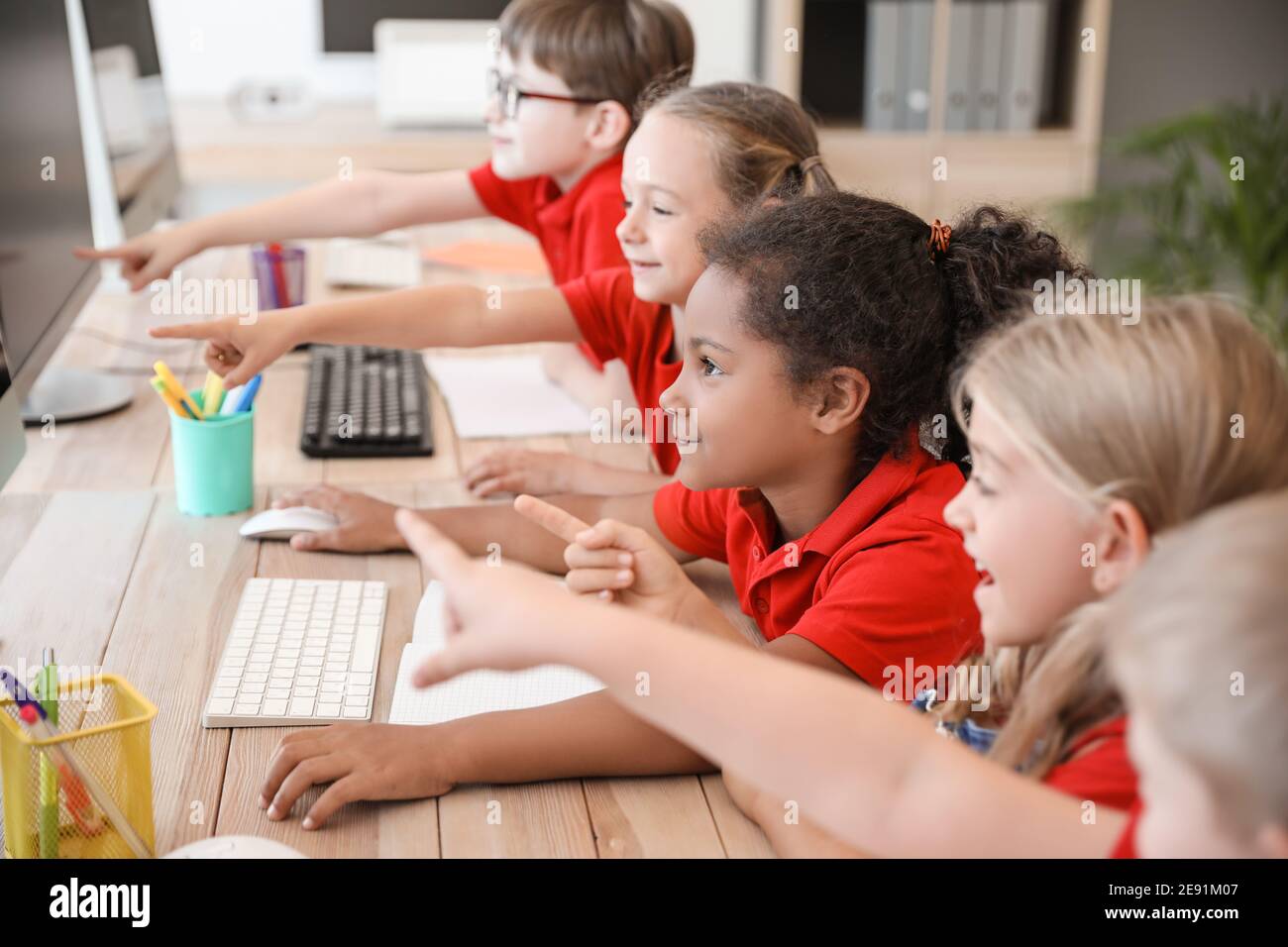 Little children during lesson in classroom Stock Photo - Alamy