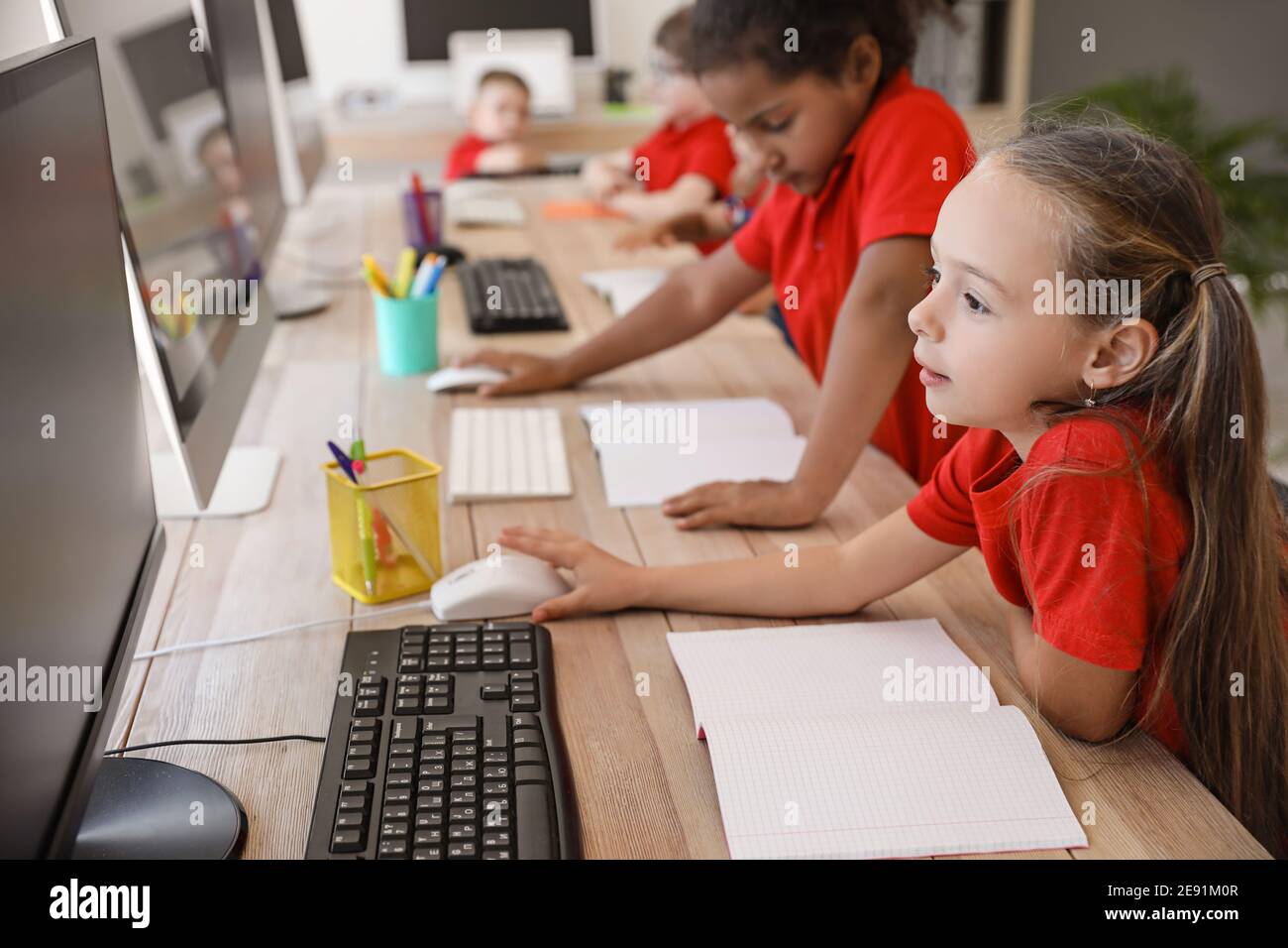 Little children during lesson in classroom Stock Photo - Alamy