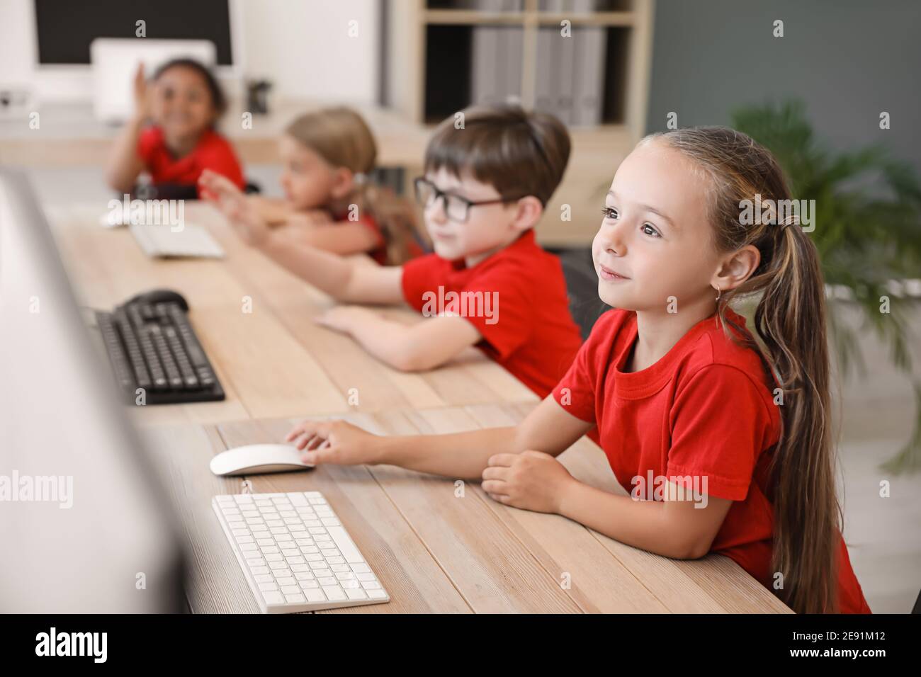 Little children during lesson in classroom Stock Photo - Alamy