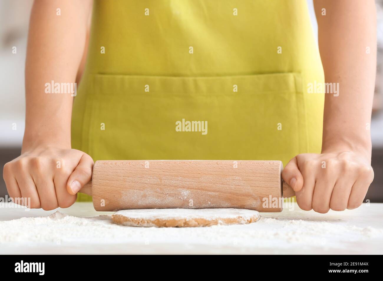 Woman making dough in kitchen Stock Photo - Alamy