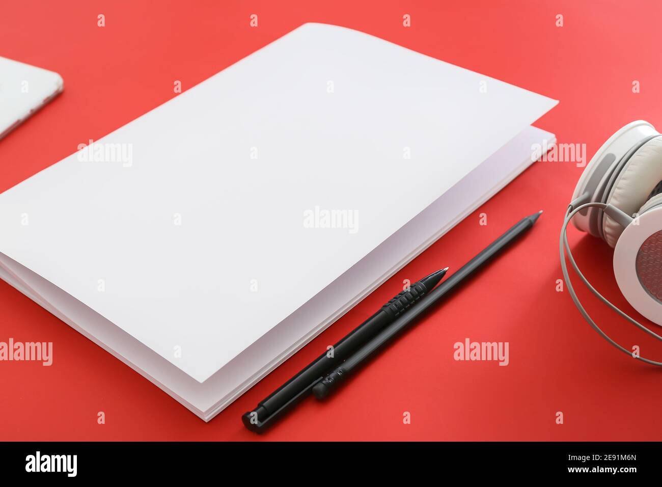Blank magazine, pencil and pen on color background Stock Photo - Alamy