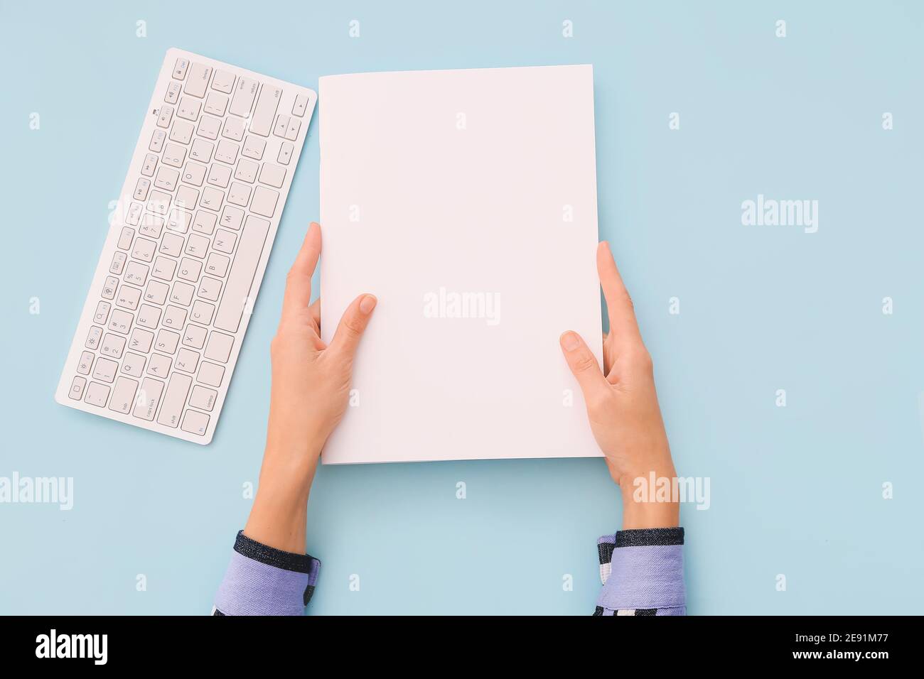 Female hands, blank magazine and keyboard on color background Stock ...