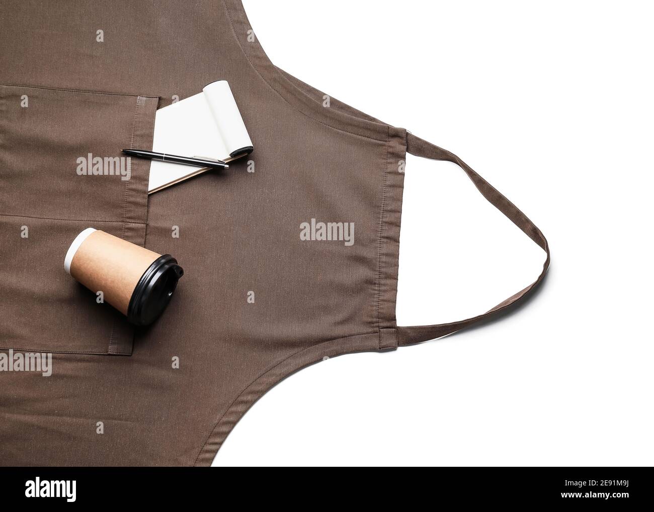 Apron, paper cup, notebook and pen on white background Stock Photo - Alamy
