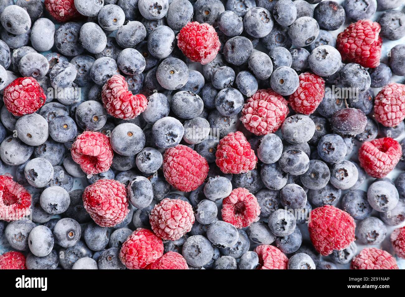 Frozen blueberry and raspberry as background Stock Photo - Alamy