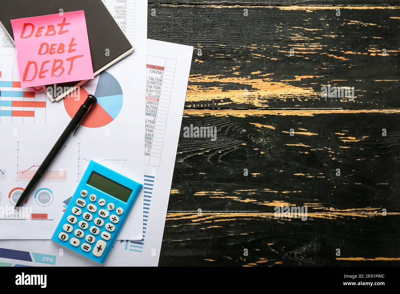 Documents and calculator on table. Concept of debt Stock Photo - Alamy