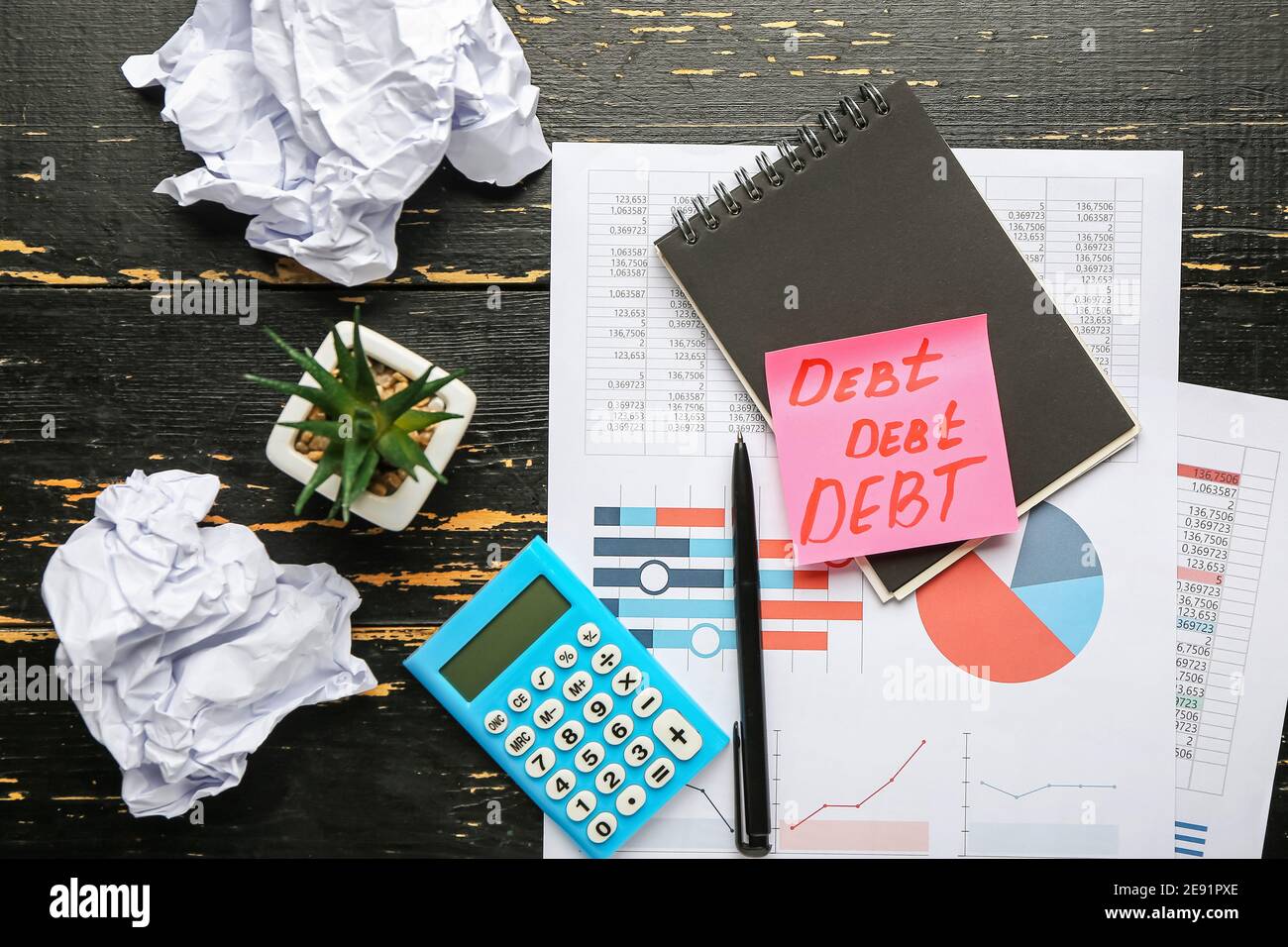 Documents and calculator on table. Concept of debt Stock Photo - Alamy